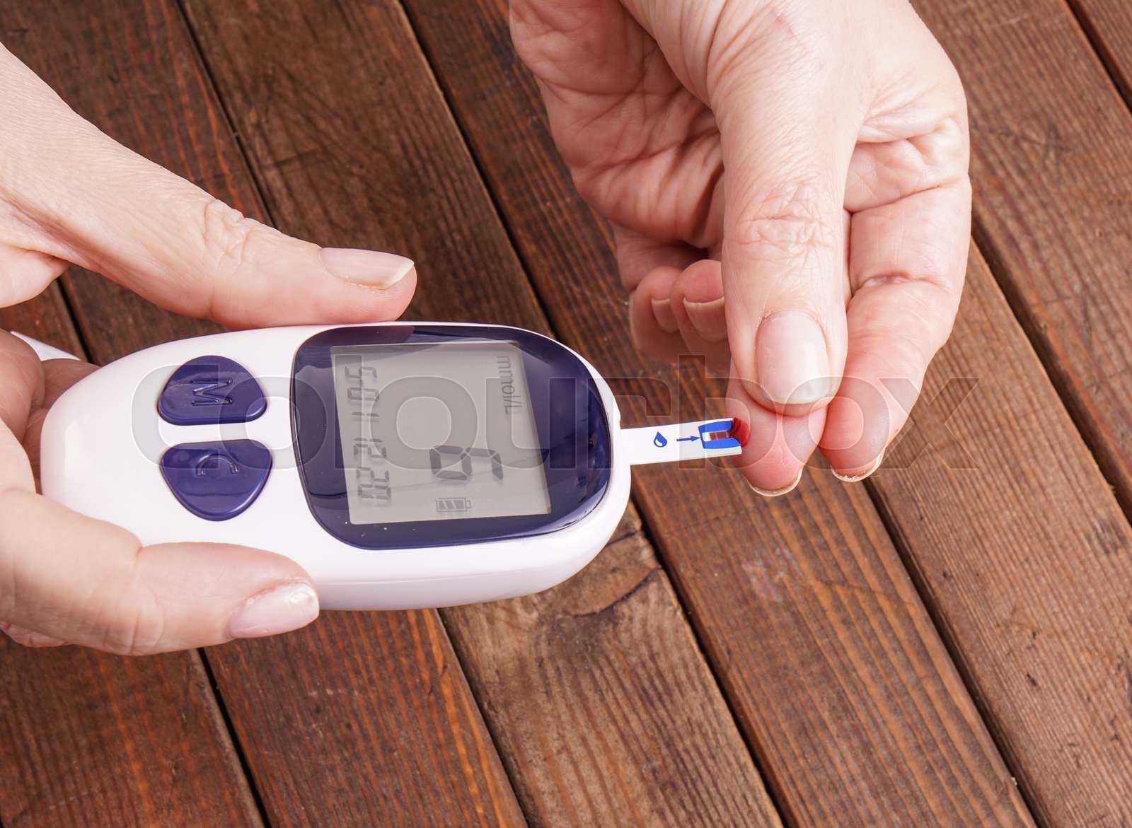 Testing the blood glucose level | Stock image | Colourbox