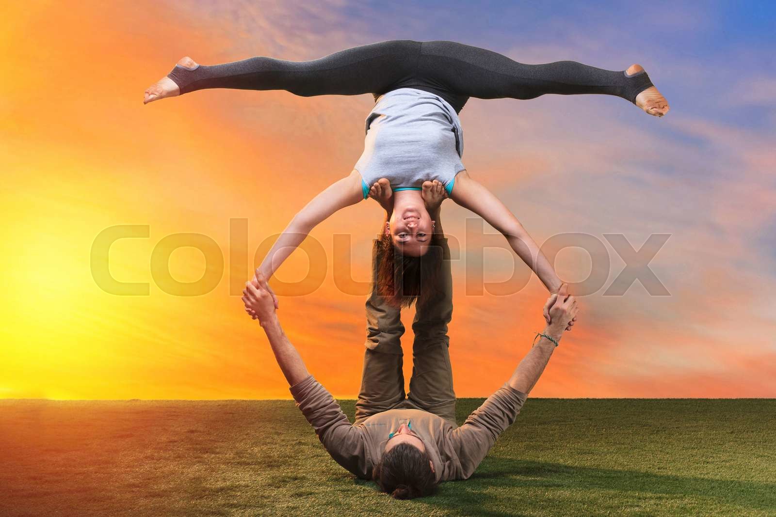 The two people doing yoga exercises | Stock image | Colourbox