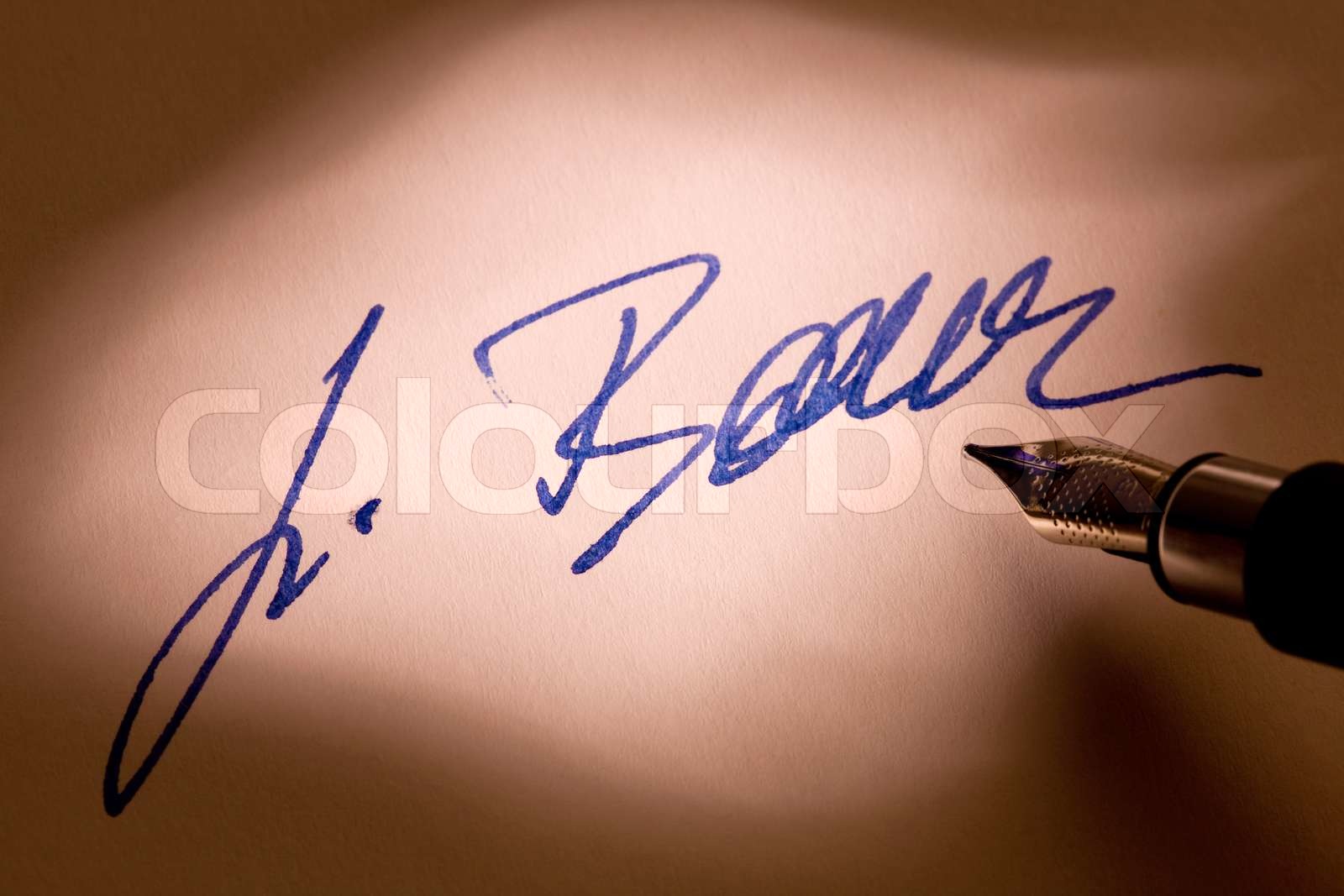 Manual signature with pen in a letter | Stock image | Colourbox