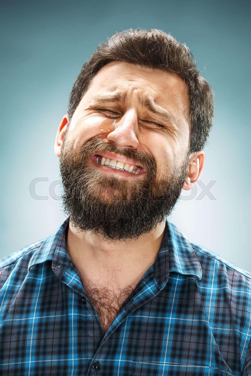 The crying man with tears on face closeup | Stock image | Colourbox