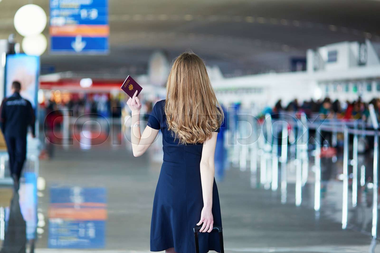 Young woman in international airport | Stock image | Colourbox