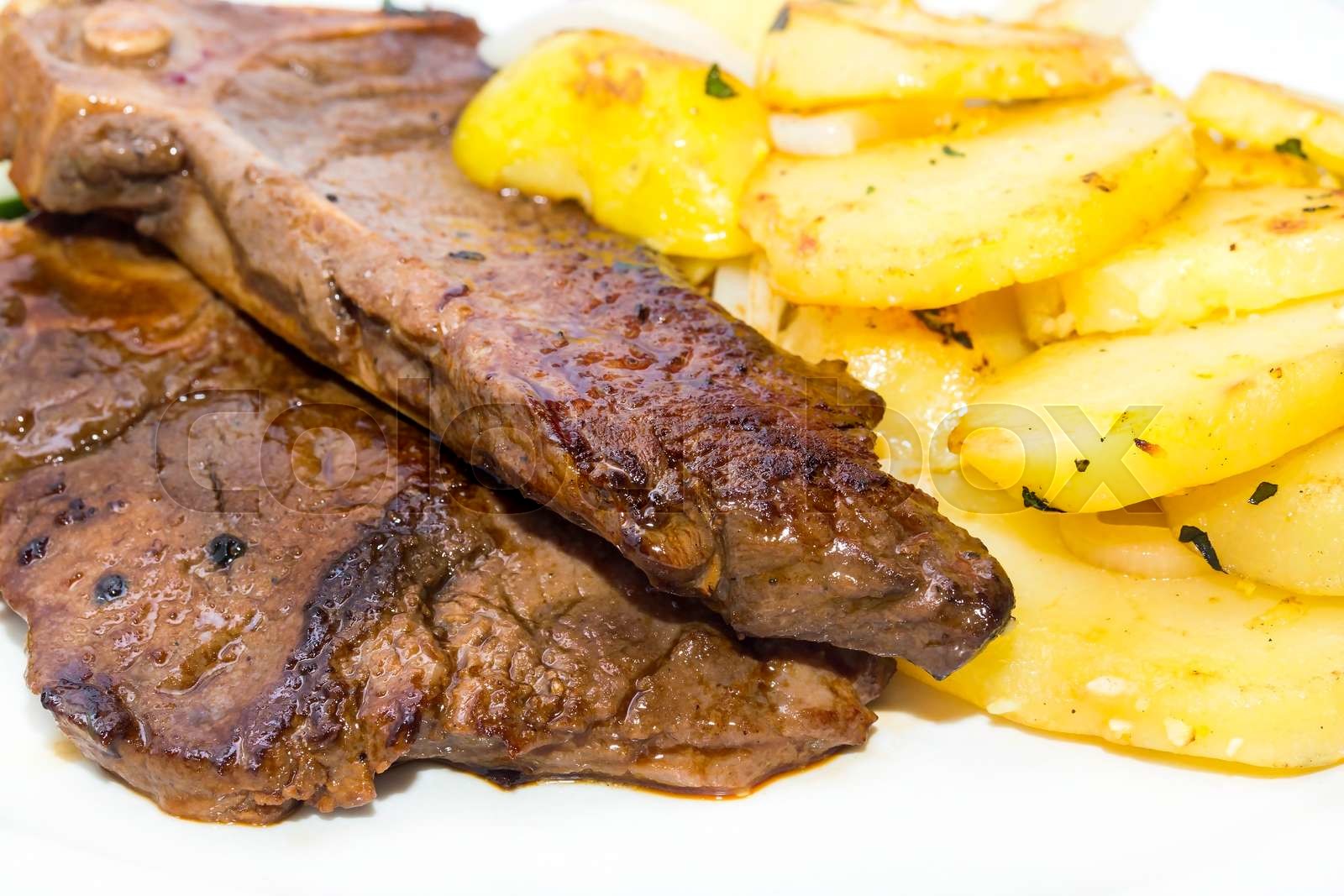 T Bone steak with potatoes and vegetables | Stock image | Colourbox