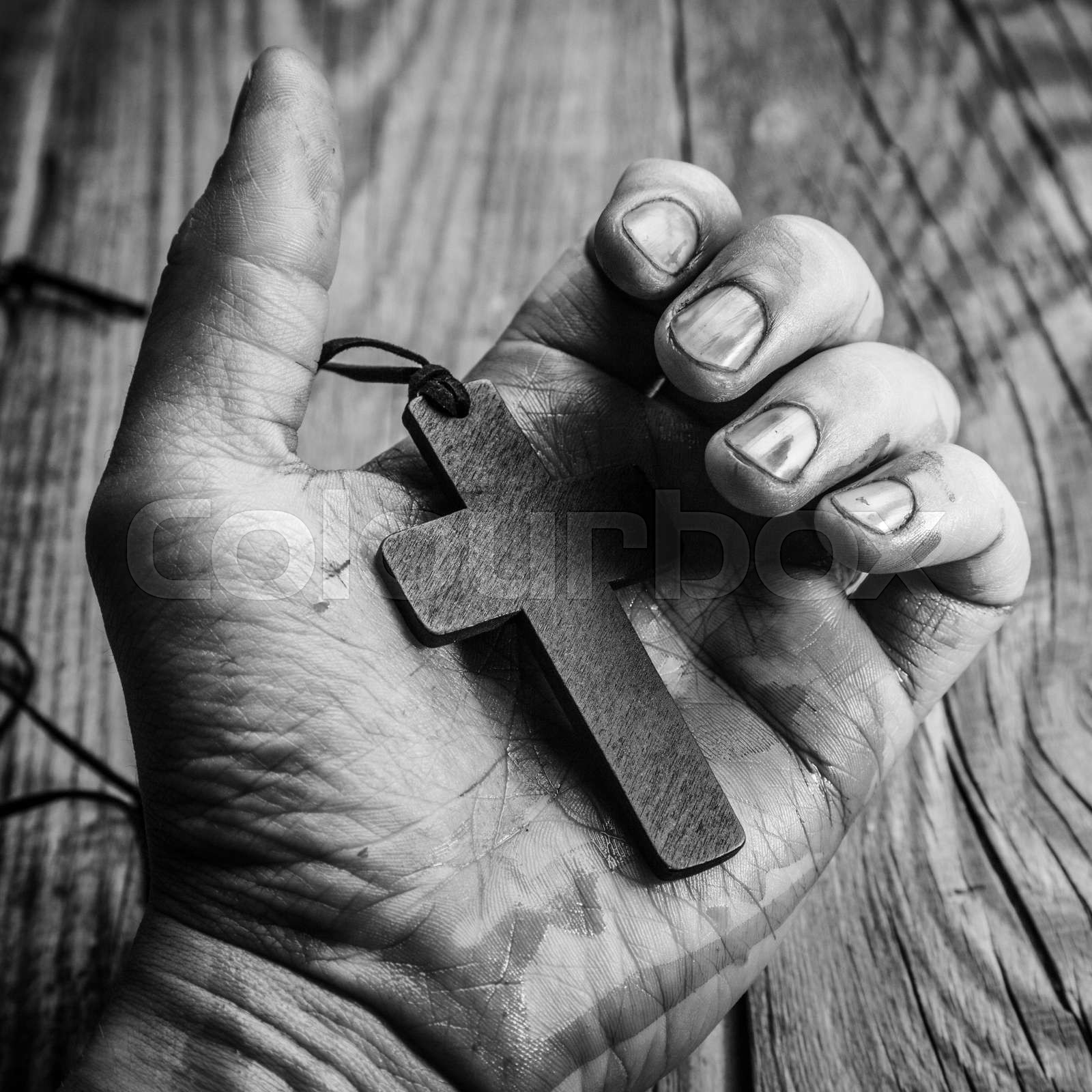 Cross in hand | Stock image | Colourbox