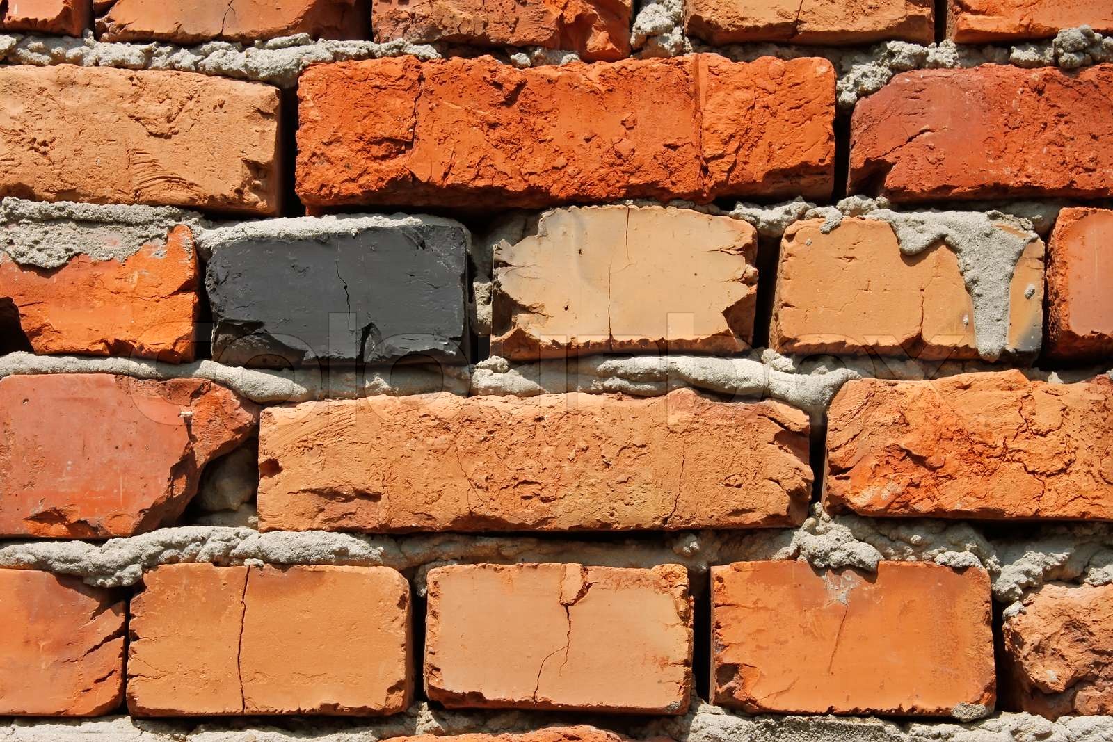 Detail of brick wall with bricks of different colors | Stock image ...