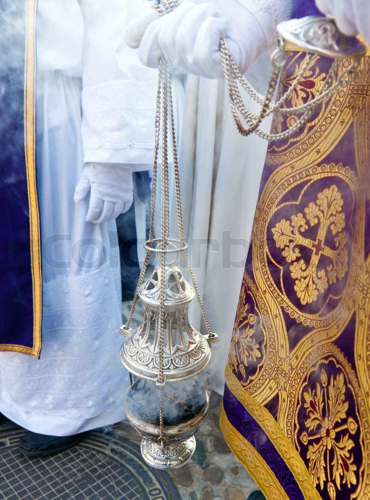A jar full of incense in a religious procession. | Stock image | Colourbox