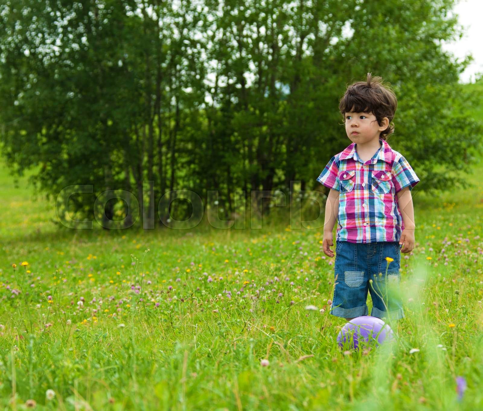sad boy waiting friend to play | Stock image | Colourbox