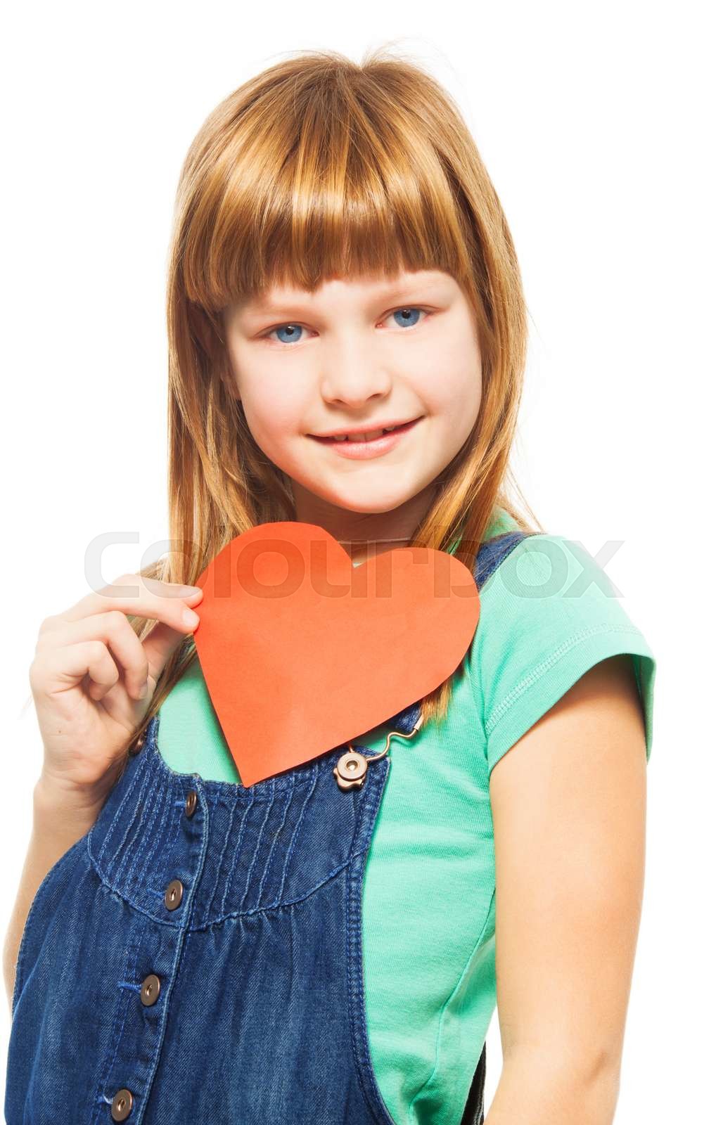 Happy girl with heart shape | Stock image | Colourbox