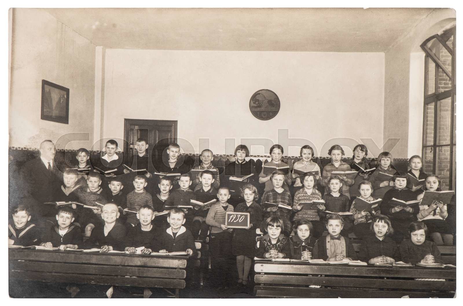 Classmates in the school. Children and teacher in classroom | Stock ...