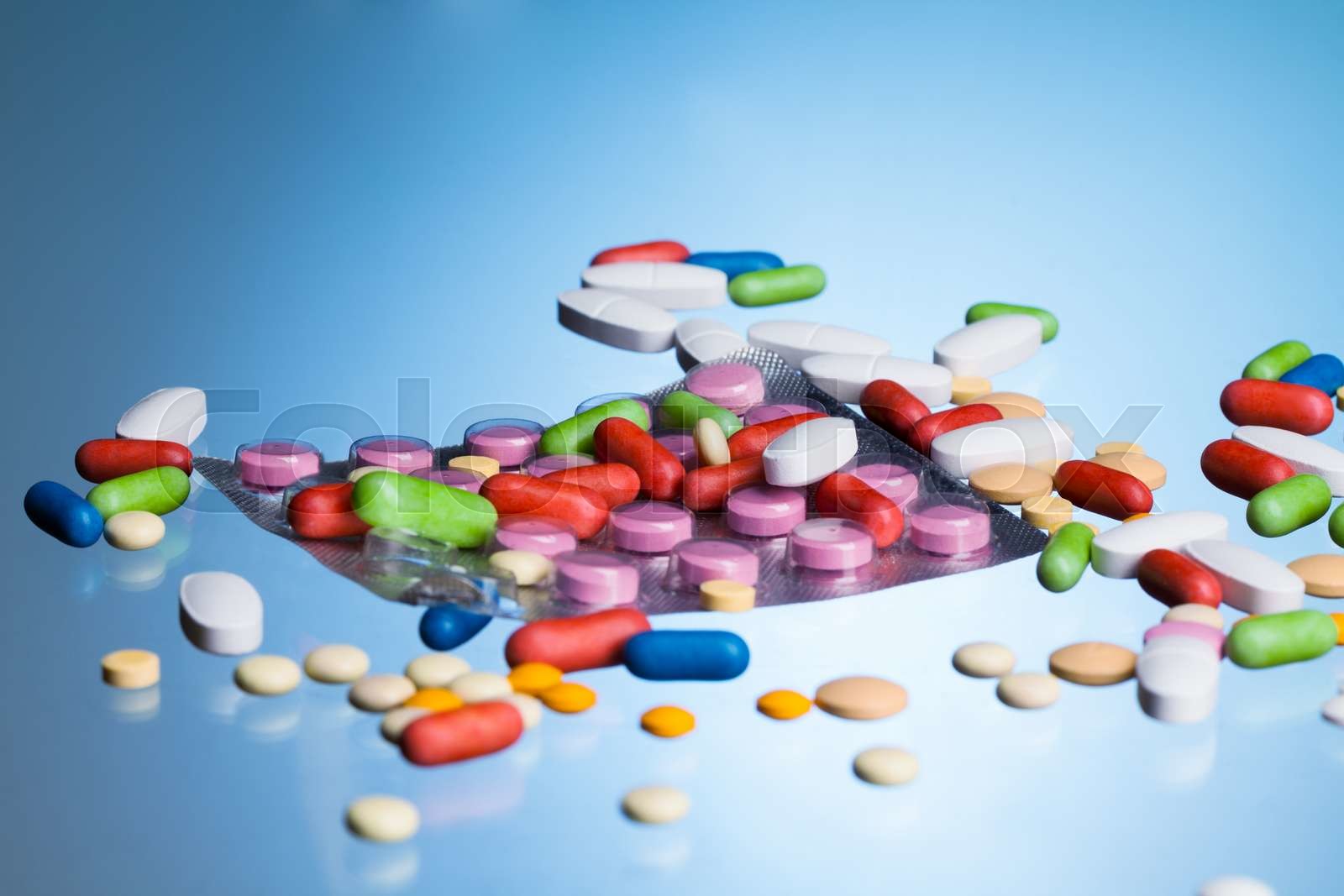 Different drug pills scattered | Stock image | Colourbox