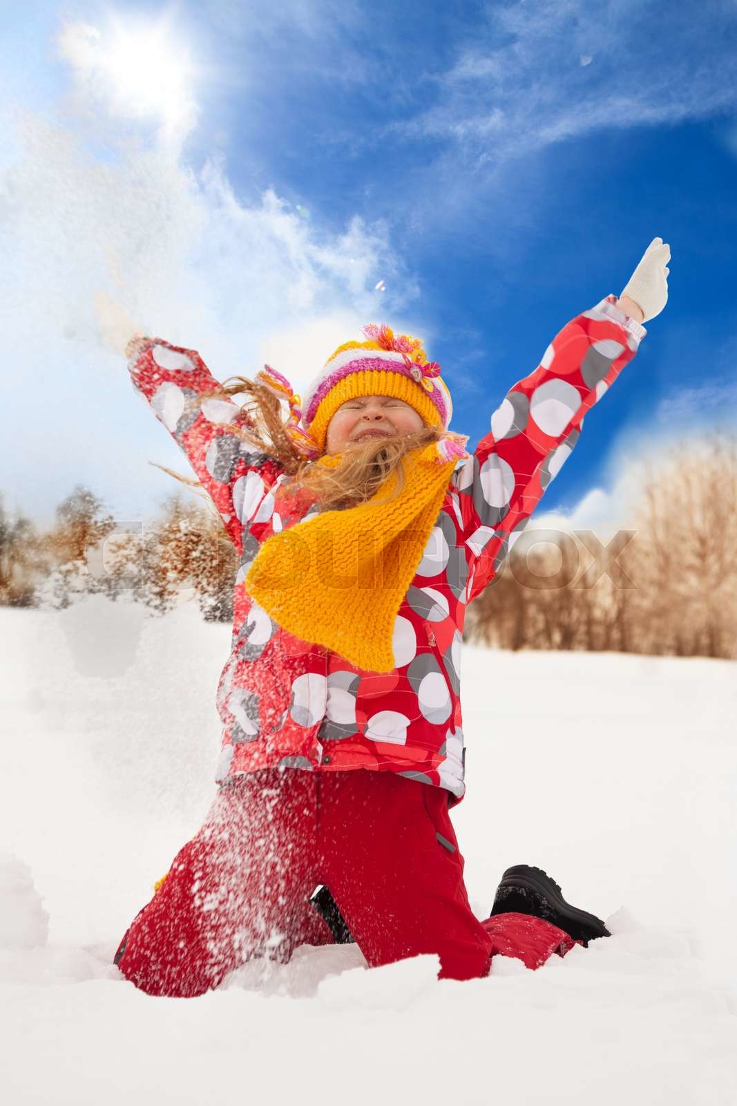 Little girl throw snow | Stock image | Colourbox