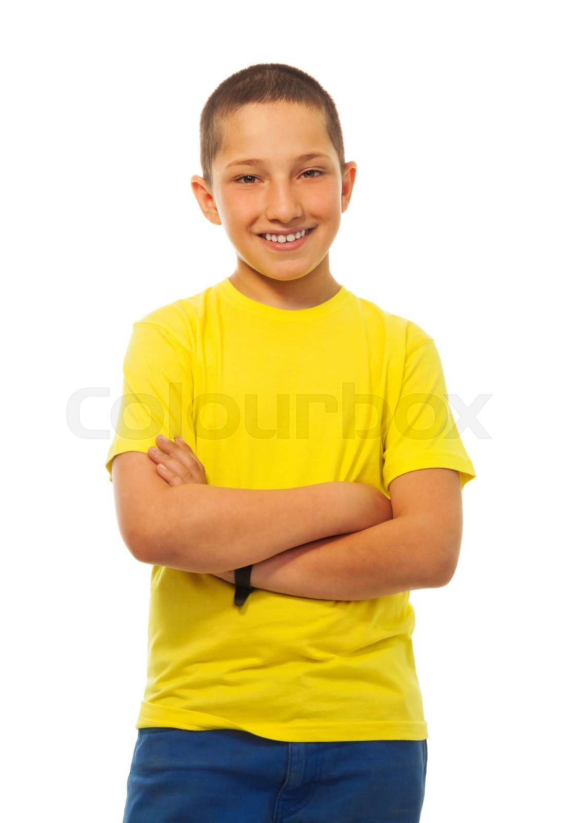 Confident boy in yellow shirt | Stock image | Colourbox