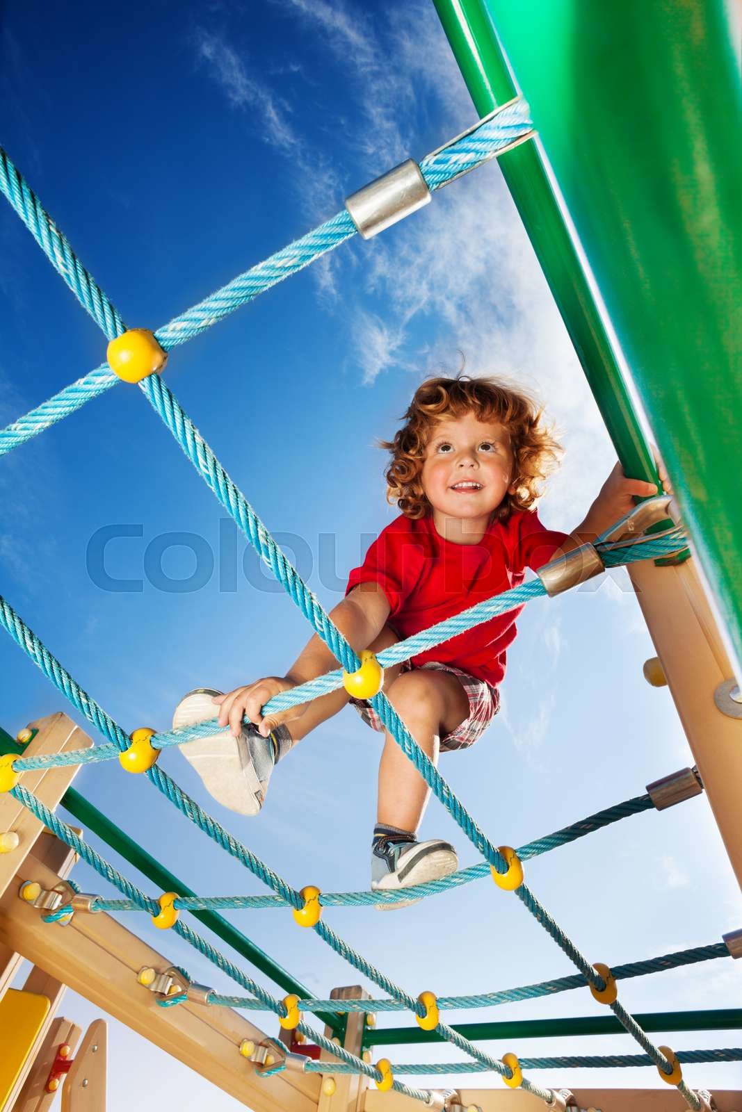 Active strong boy on playground | Stock image | Colourbox