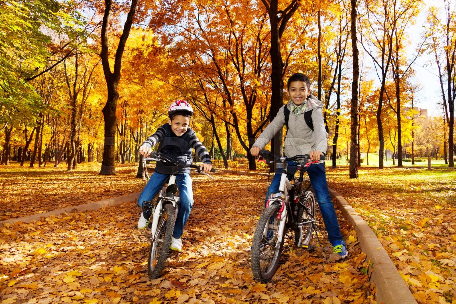 Black happy boys on bikes | Stock image | Colourbox