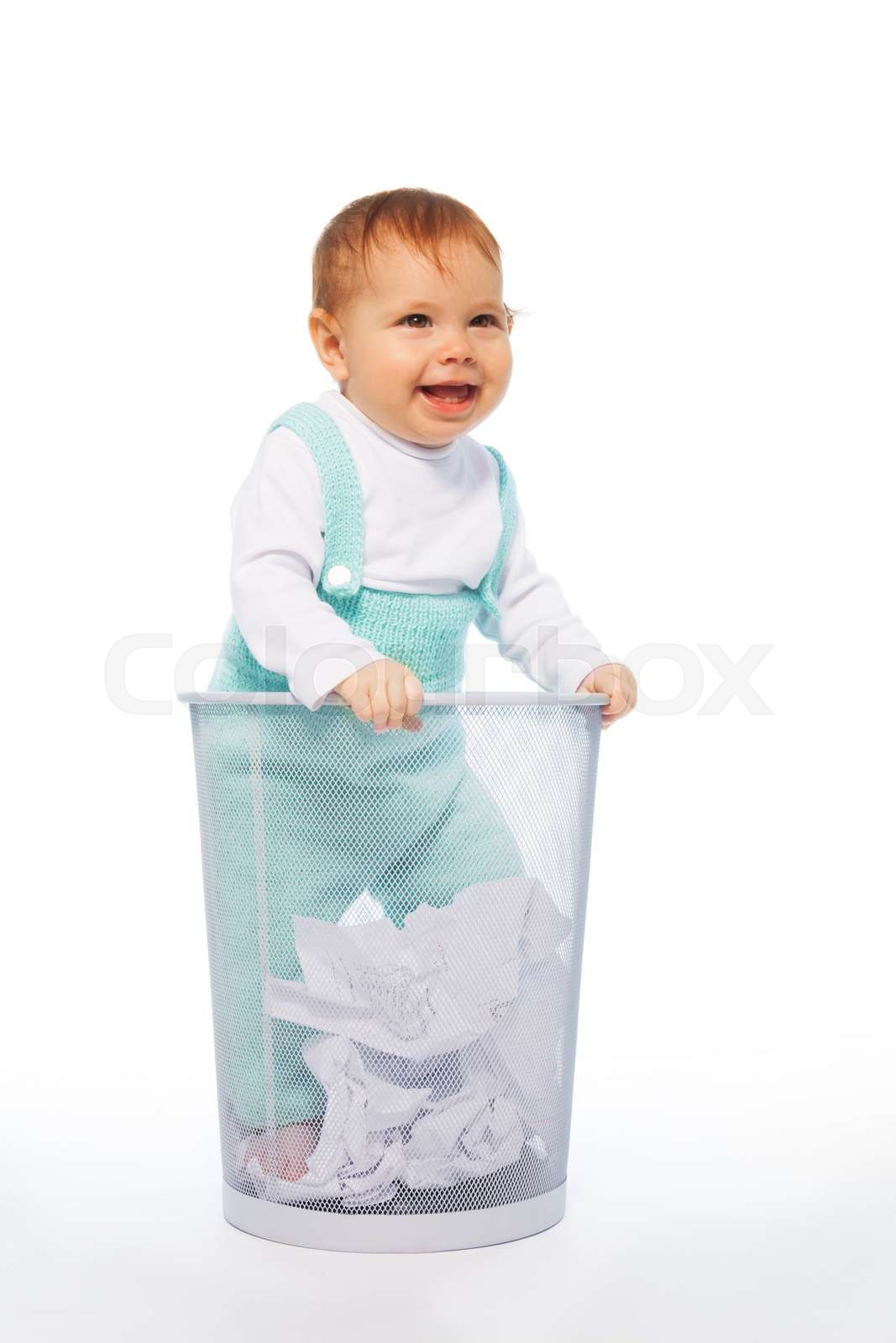 Baby in the garbage basket | Stock image | Colourbox