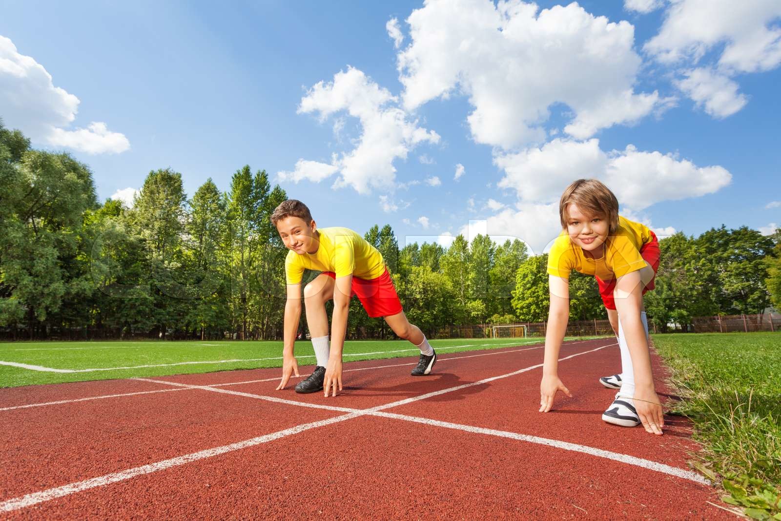 Two boys in ready position to run marathon | Stock image | Colourbox