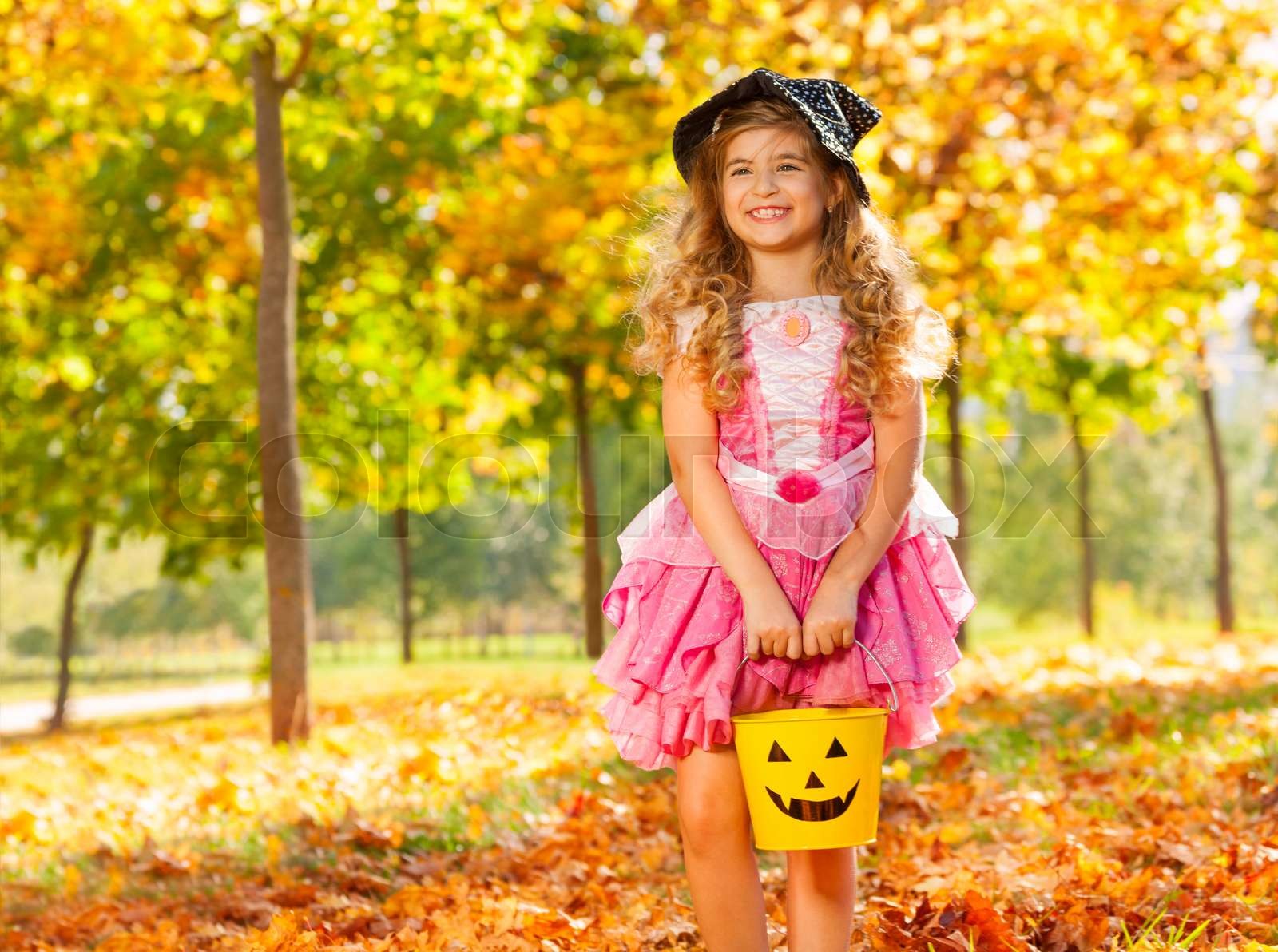 Girl in costume of princess hold small bucket | Stock image | Colourbox