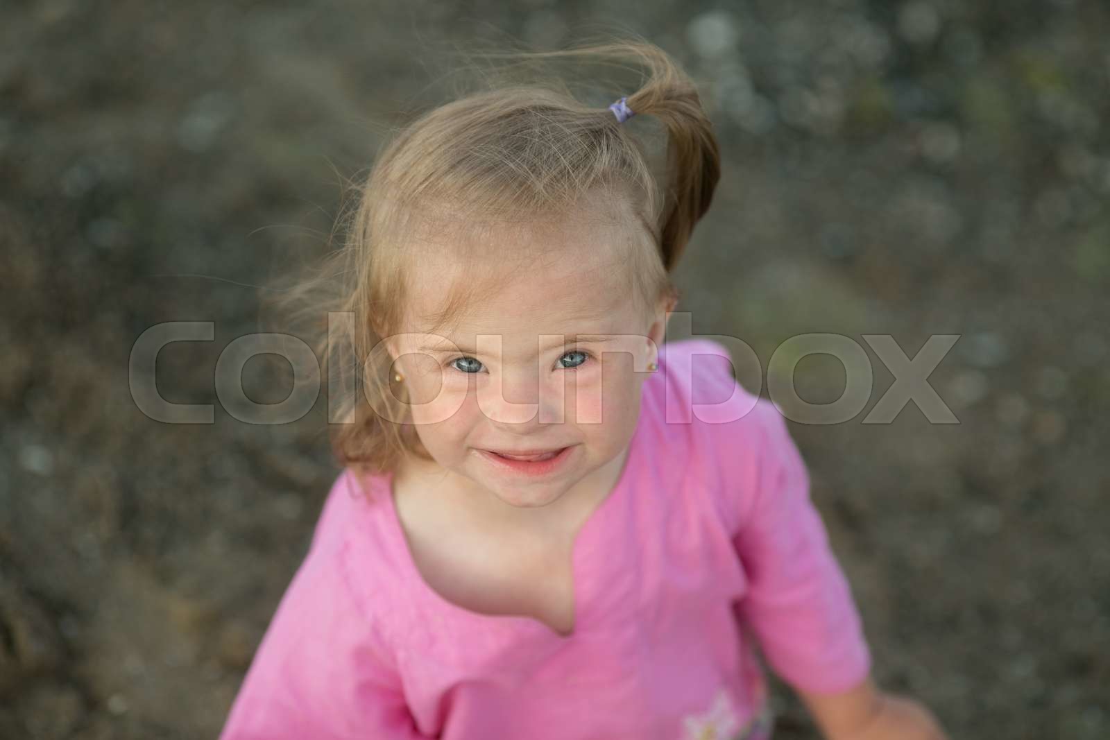 beautiful girl with Down syndrome on the beach | Stock image | Colourbox