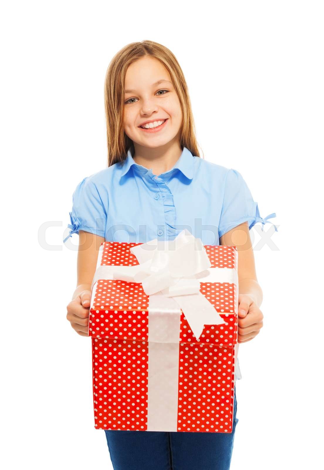 Little girl with big red present | Stock image | Colourbox