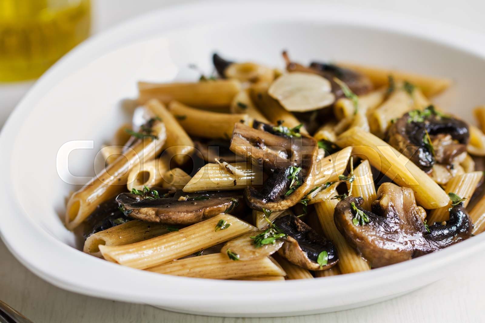 Penne with mushroom and herb sauce | Stock image | Colourbox