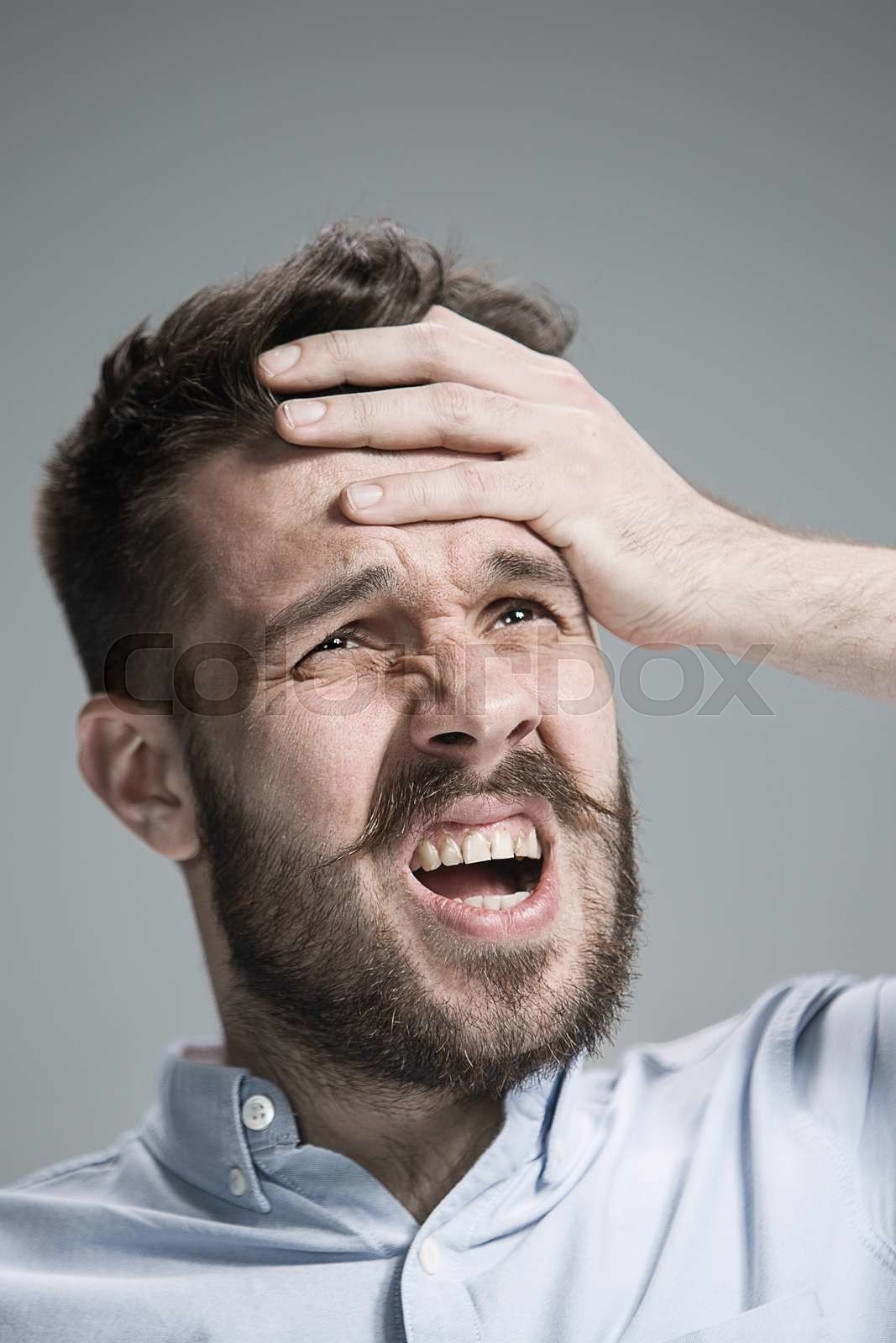 Close up face of desperate man | Stock image | Colourbox