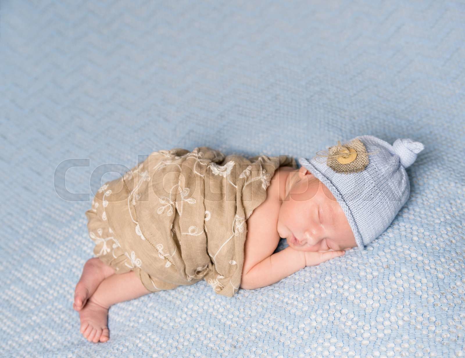 sleeping newborn baby with lovely cheeks | Stock image | Colourbox