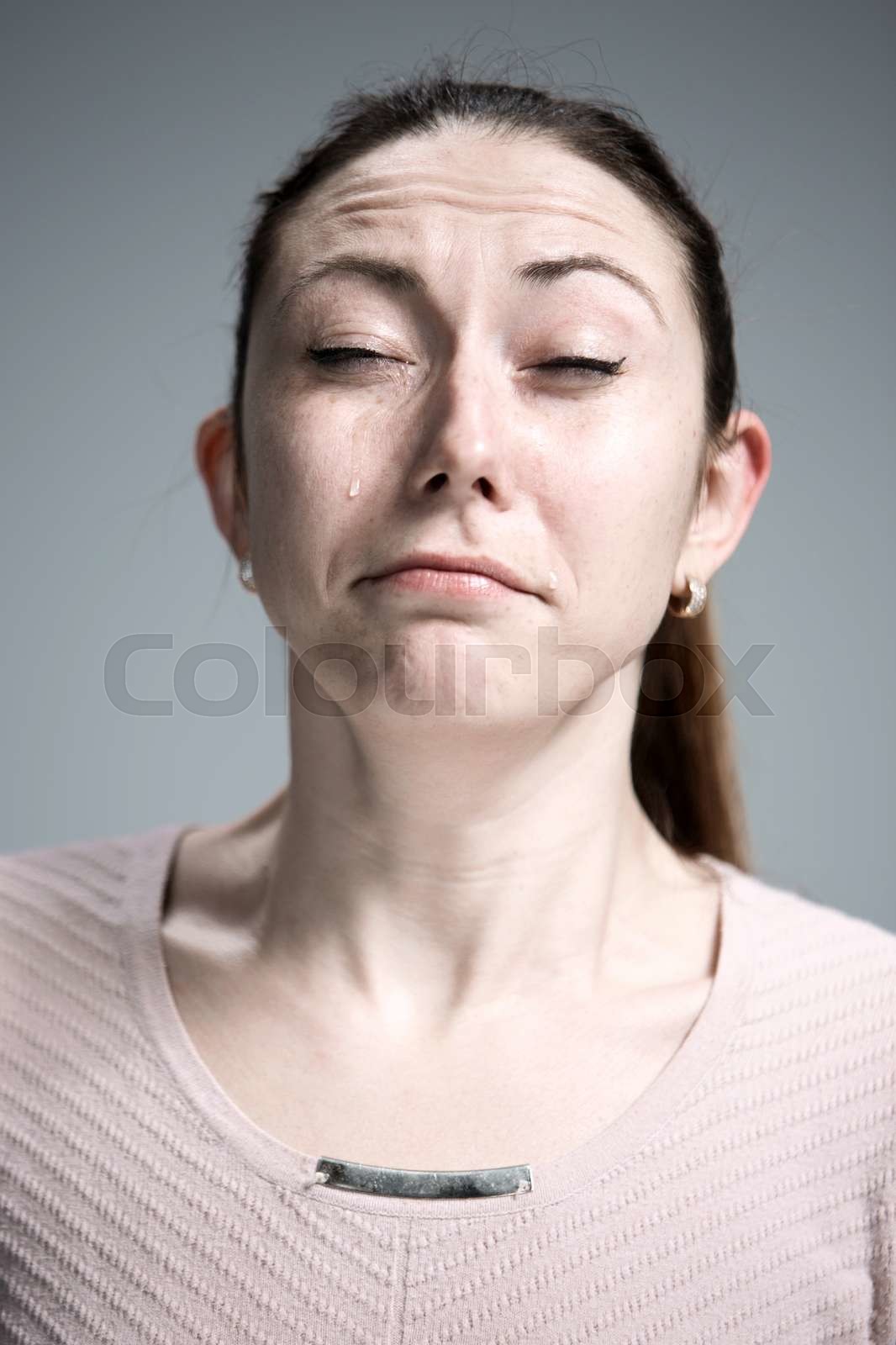 The crying woman with tears on face closeup | Stock image | Colourbox