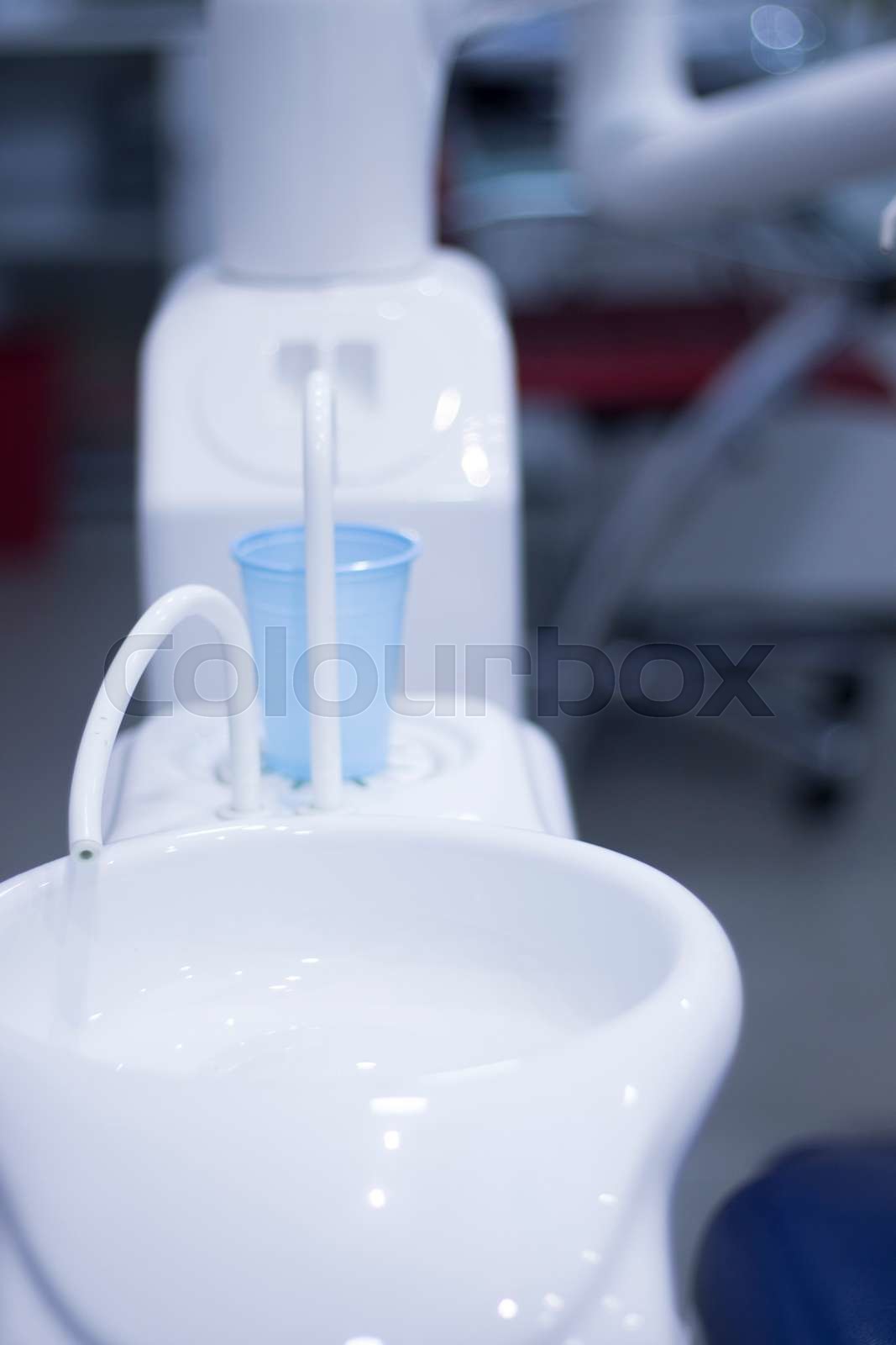 Dentist's chair and mouth rinse cup | Stock image | Colourbox