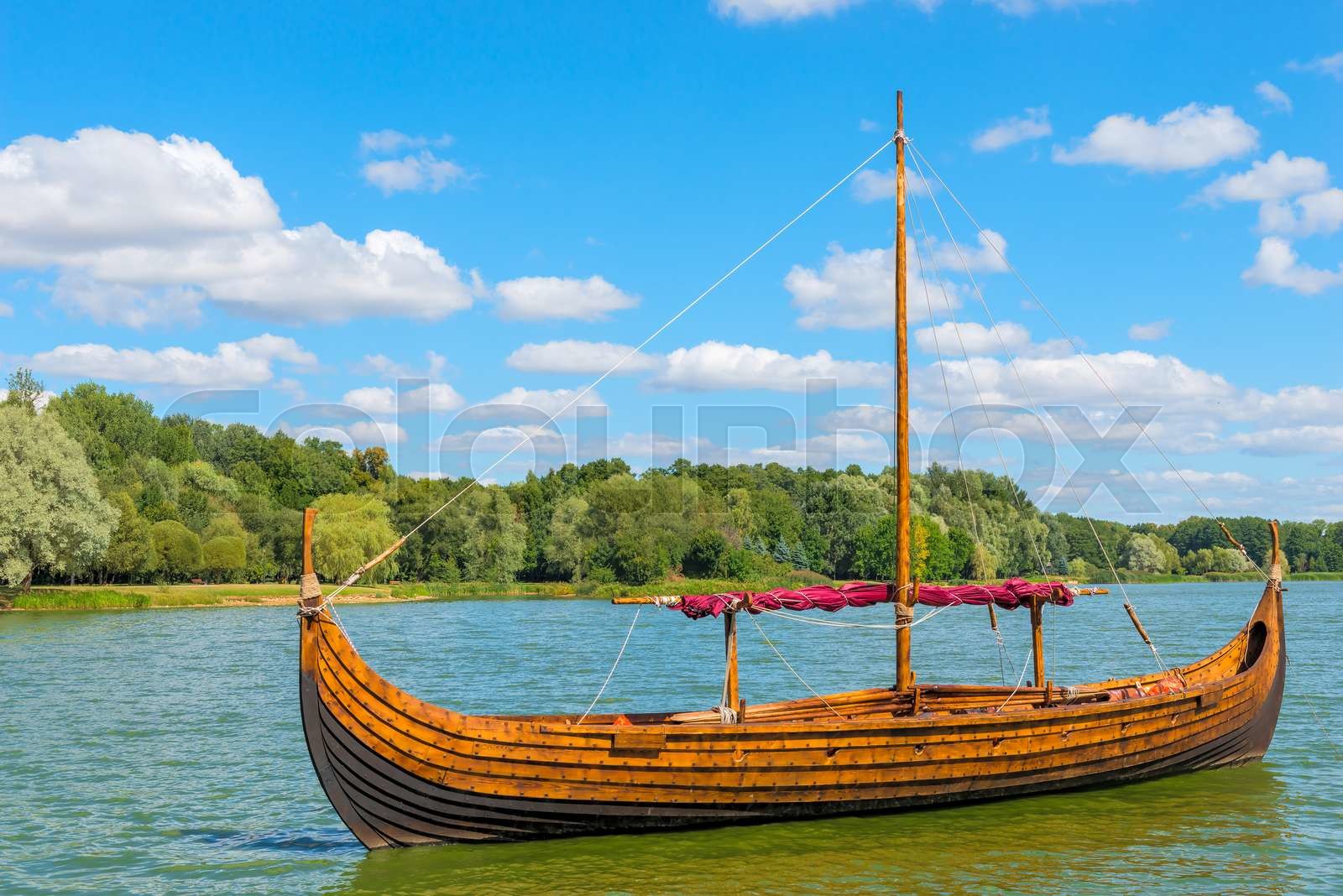 Vintage wooden Viking boat on the lake | Stock image | Colourbox