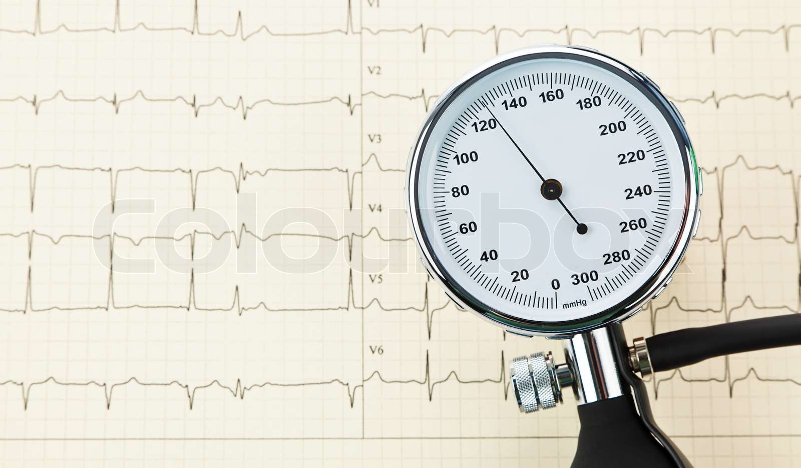 A blood pressure monitor and an ECG curve. Hypertension and heart ...