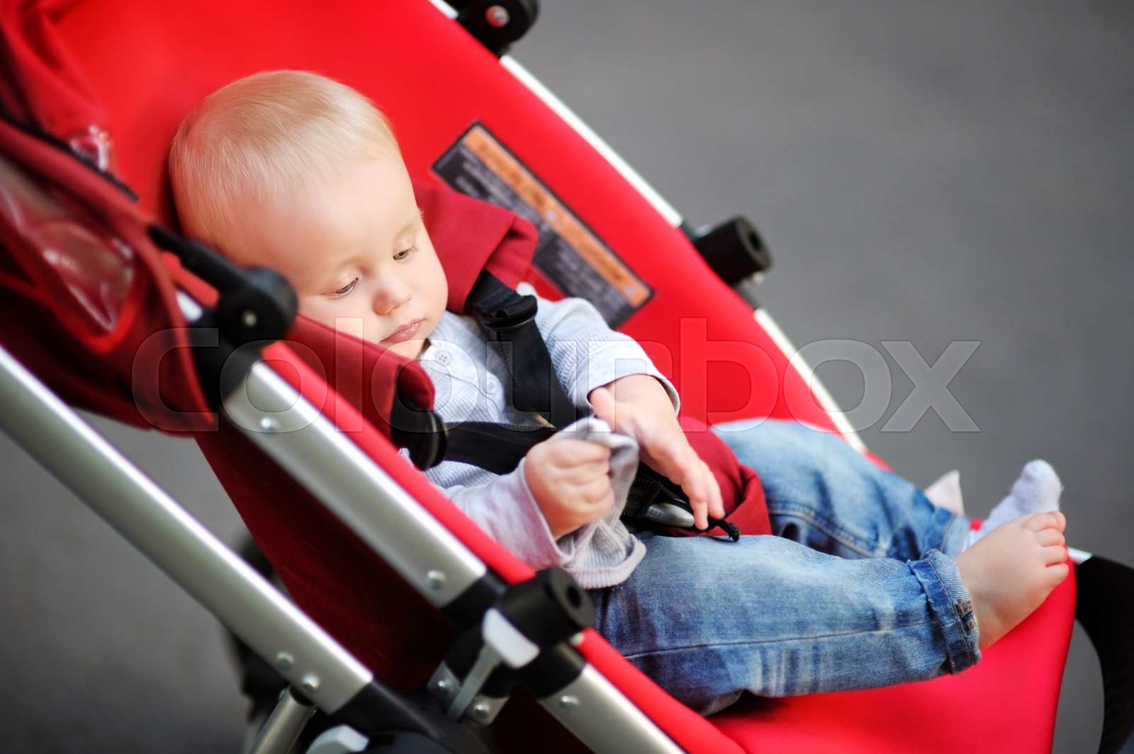 Little baby boy in stroller | Stock image | Colourbox