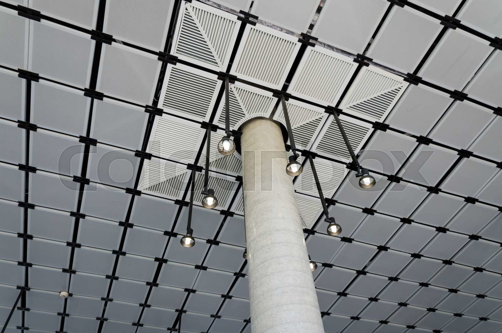 Bare concrete column with suspended ceiling | Stock image | Colourbox