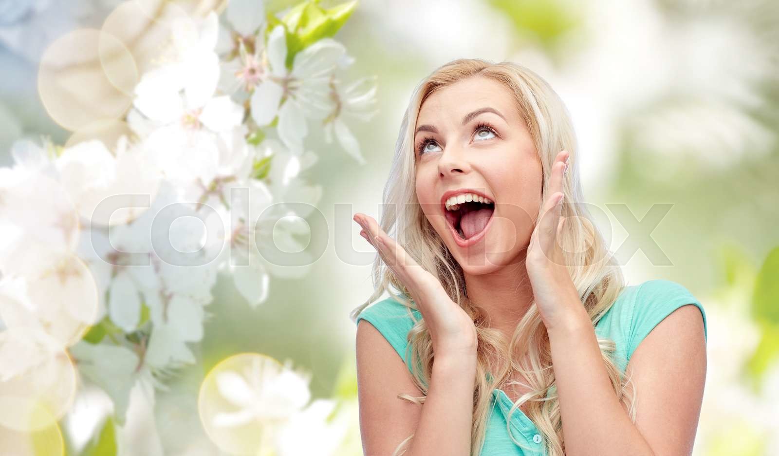 surprised smiling young woman or teenage girl | Stock image | Colourbox
