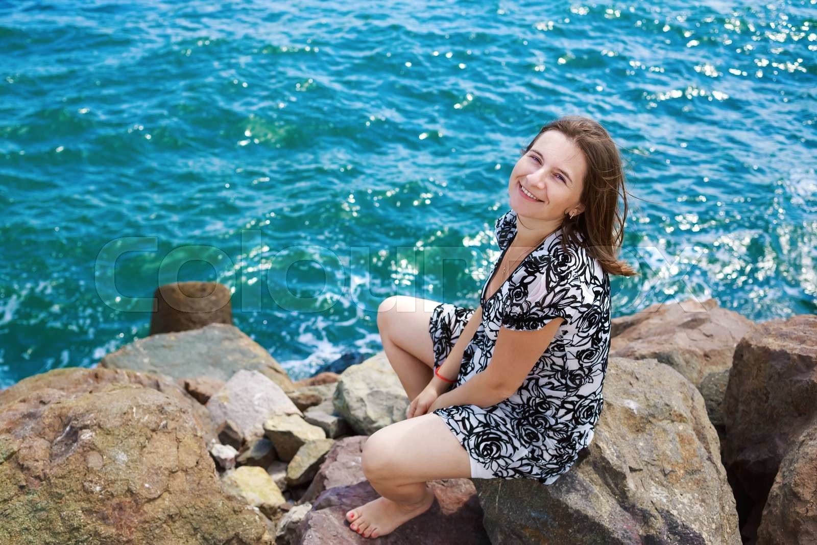 Woman on the cliff edge | Stock image | Colourbox