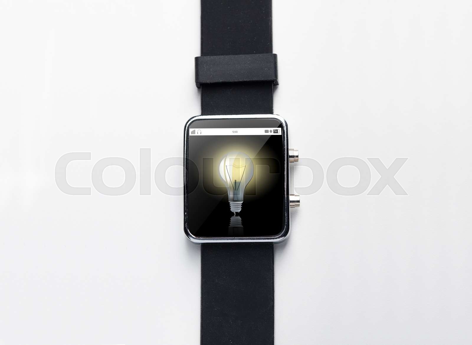 close up of smart watch with light bulb on screen | Stock image | Colourbox