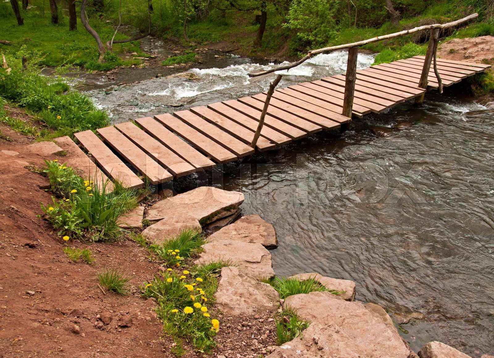 Beautiful Wooden Bridge With Stream