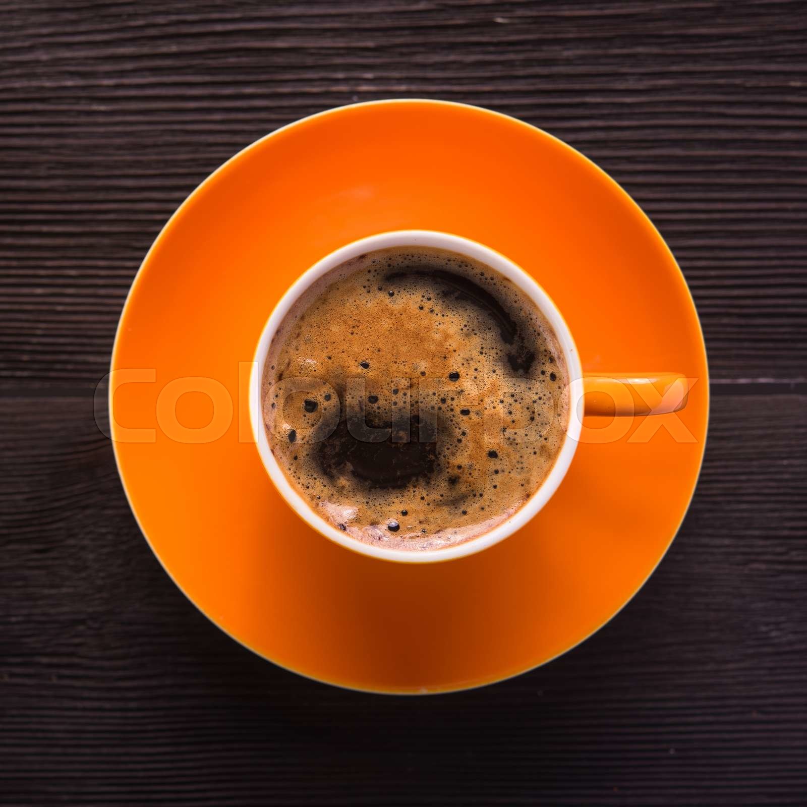 Orange cup of coffee | Stock image | Colourbox