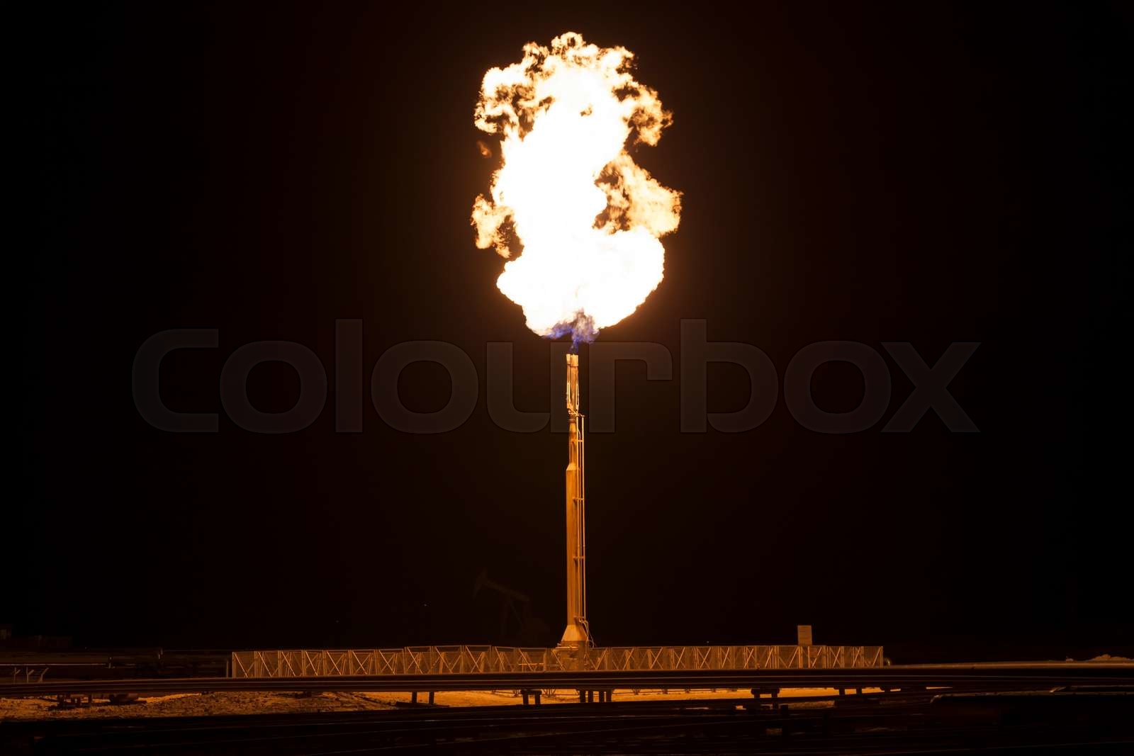 Gas flame torch on a oil refinery plant | Stock image | Colourbox