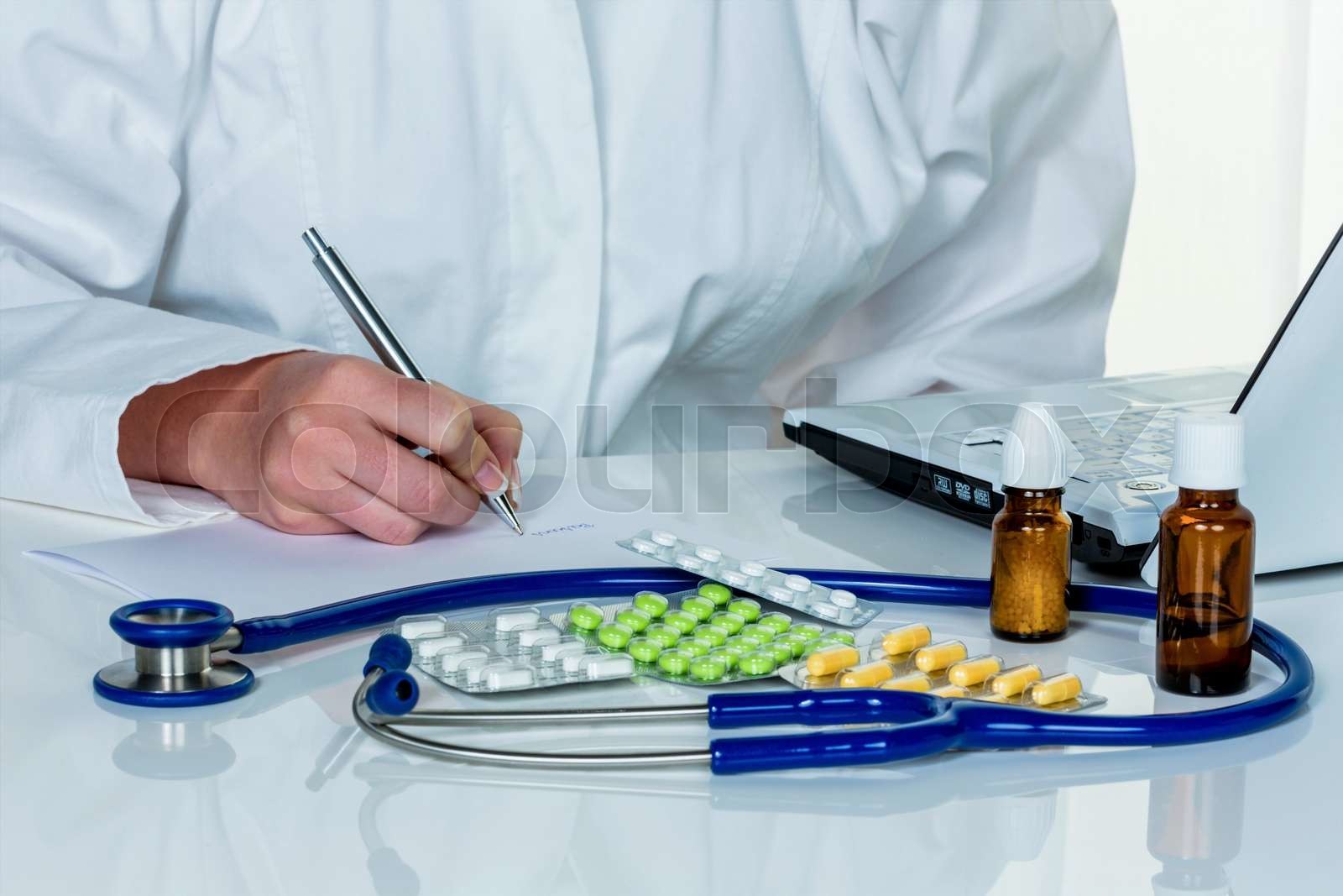 doctor prescribes a drug | Stock image | Colourbox