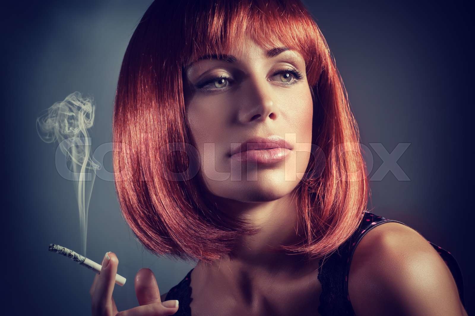 Gorgeous woman smoking | Stock image | Colourbox