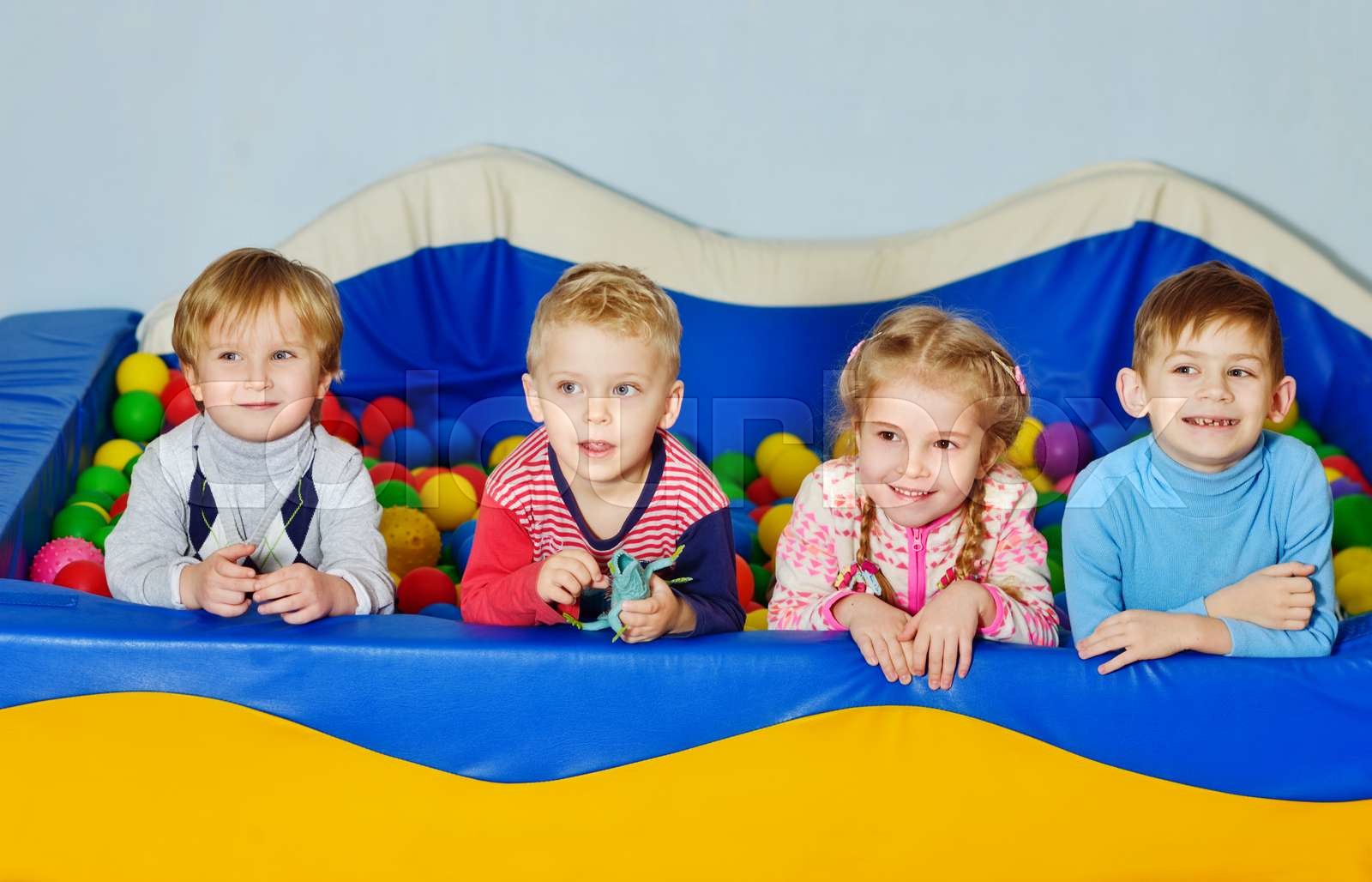 children playing in pool with balls | Stock image | Colourbox