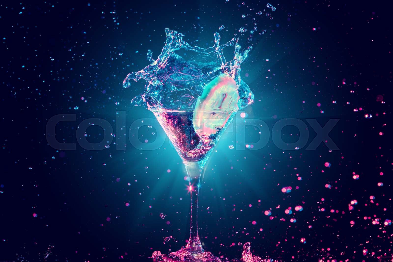 Colourful cocktail in glass with splash | Stock image | Colourbox