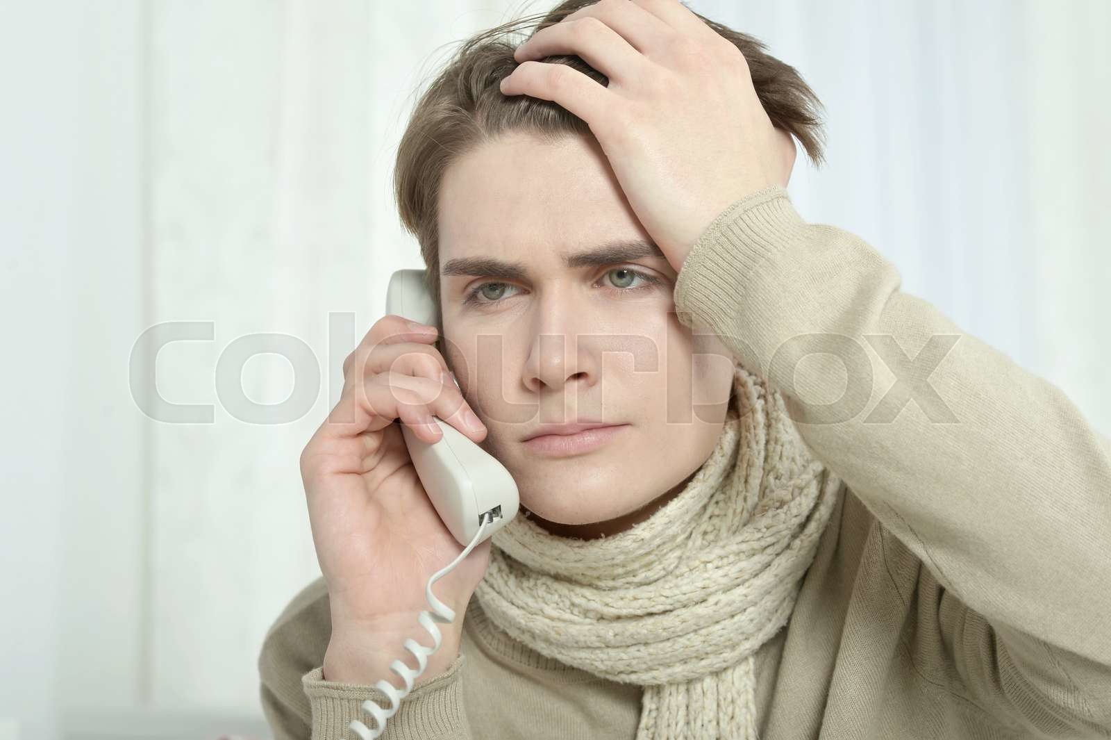 sick man calling his doctor | Stock image | Colourbox