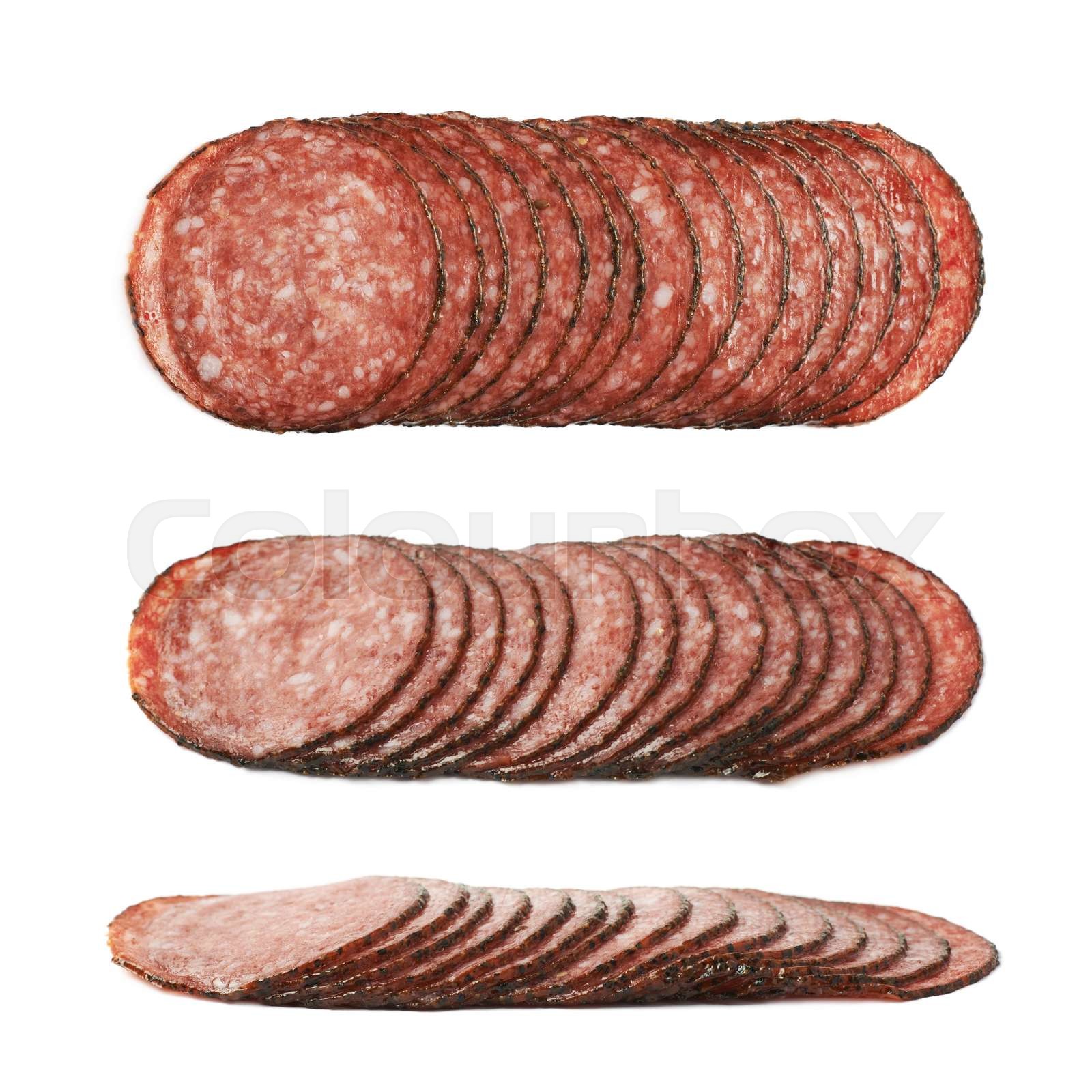 Stack of multiple salami slices isolated | Stock image | Colourbox