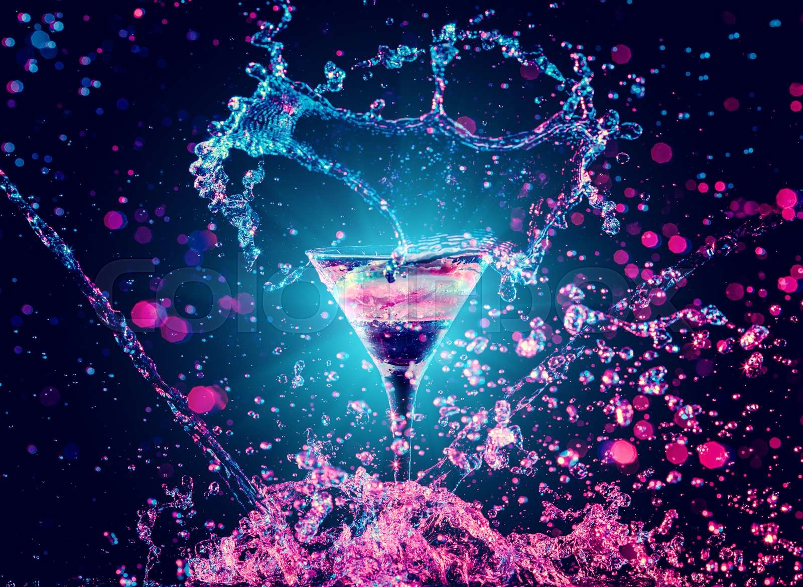 Colourful cocktail in glass with splash | Stock image | Colourbox
