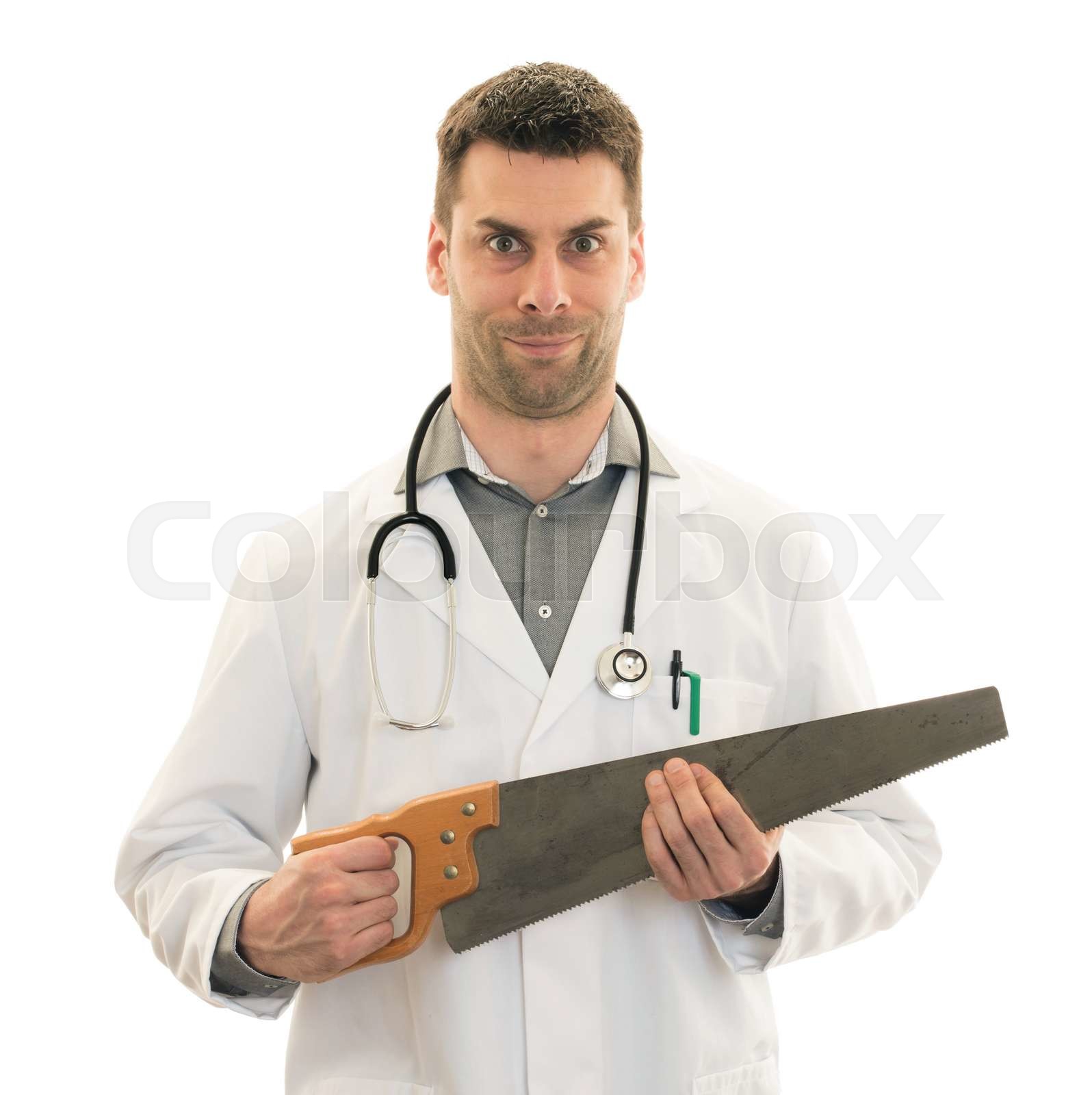 Crazy doctor is holding a big saw in his hands | Stock image | Colourbox
