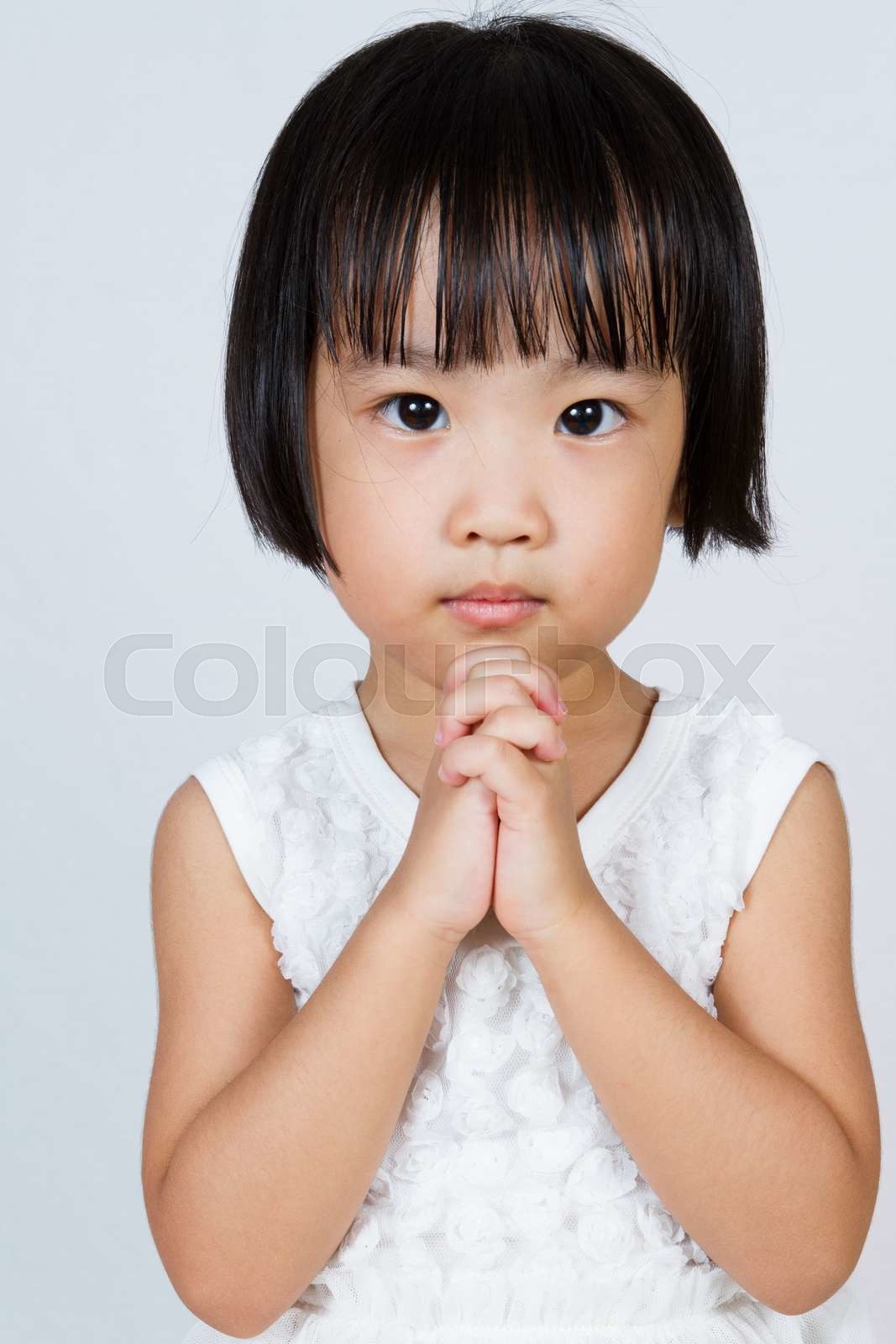 Asian Little Chinese Girl Praying | Stock image | Colourbox