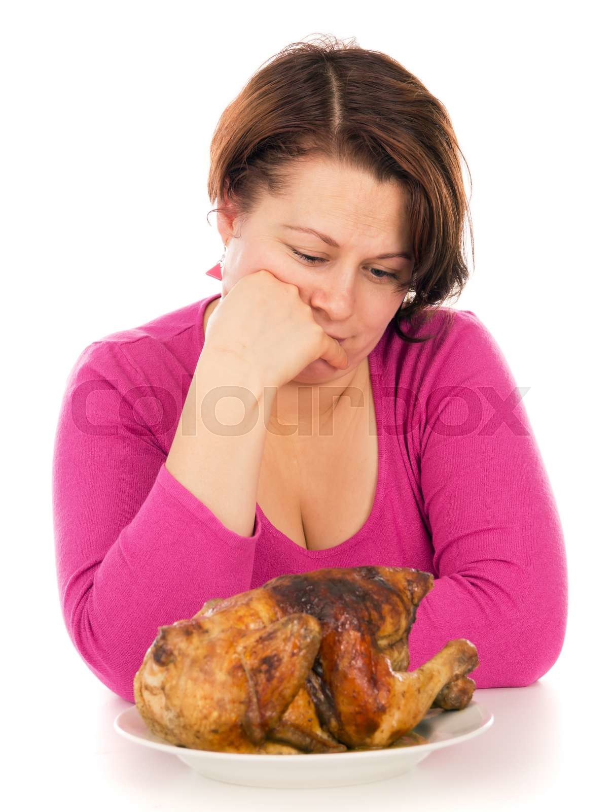Full woman on a diet, want to eat chicken | Stock image | Colourbox