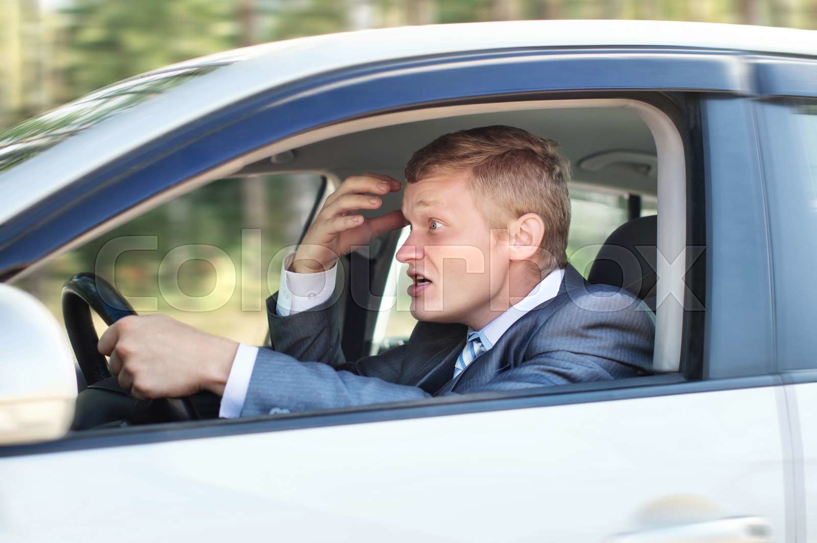 Aggressive driver behind the wheel | Stock image | Colourbox