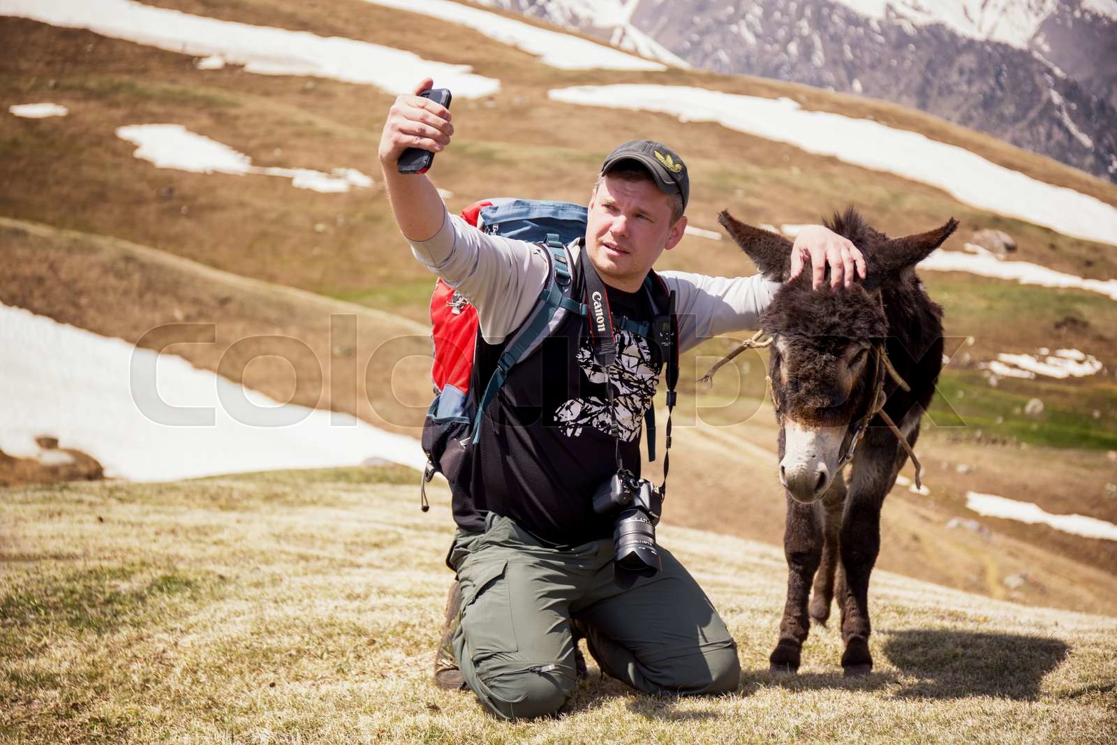 Boy rides a donkey | Stock image | Colourbox