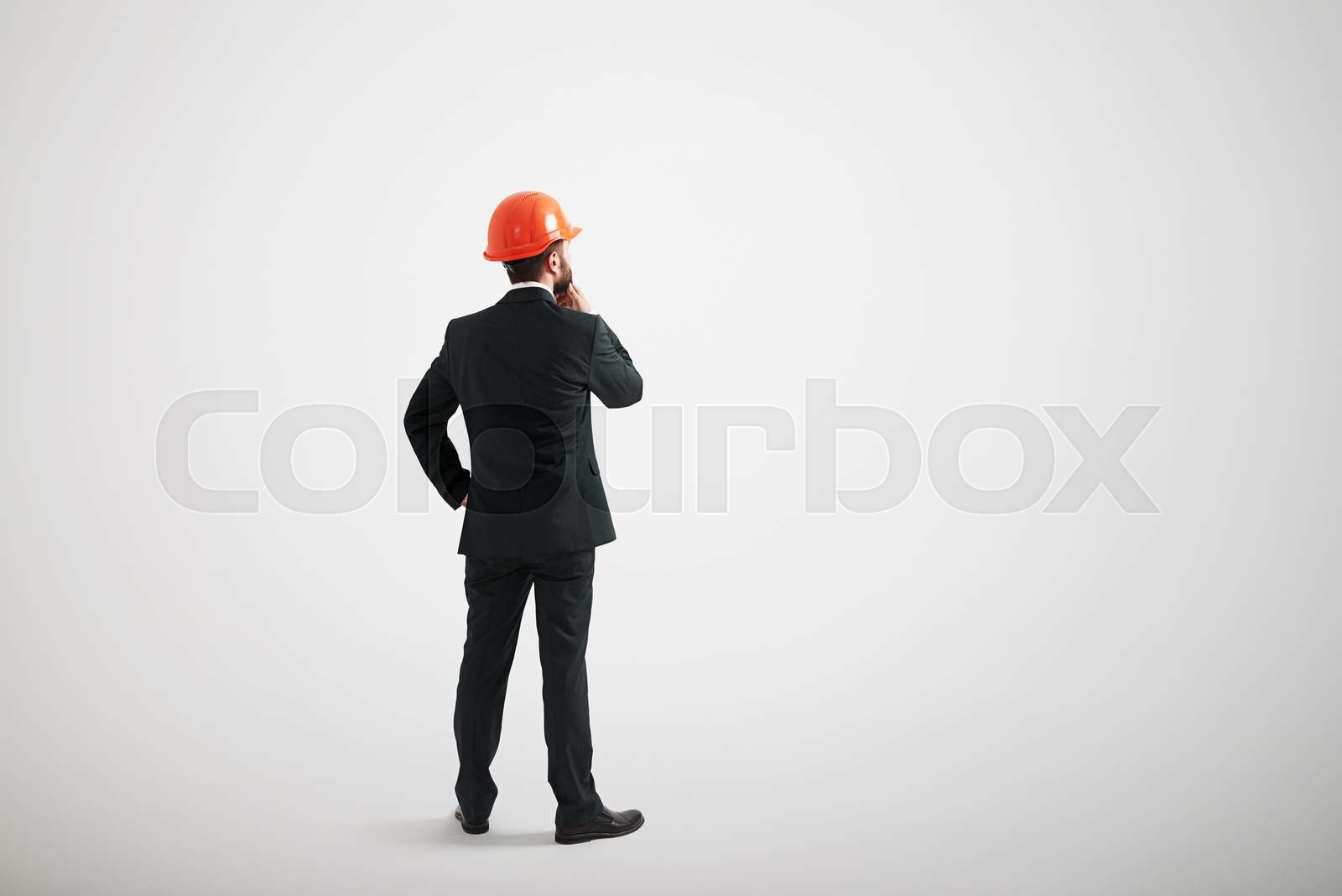 Back view of man standing straight and touching his beard | Stock image ...